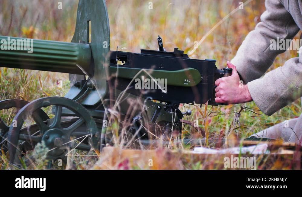A military man fixing the position of a machine gun Stock Video Footage ...
