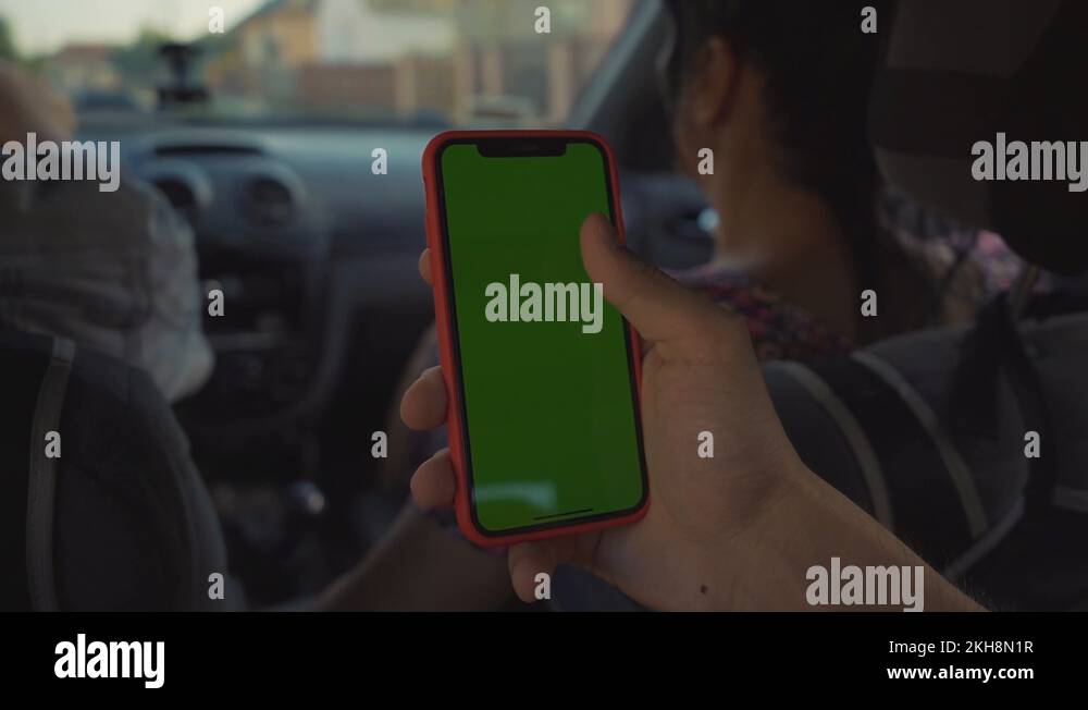 Close up man hands use smartphone with vertical green screen in car background Stock Video ...