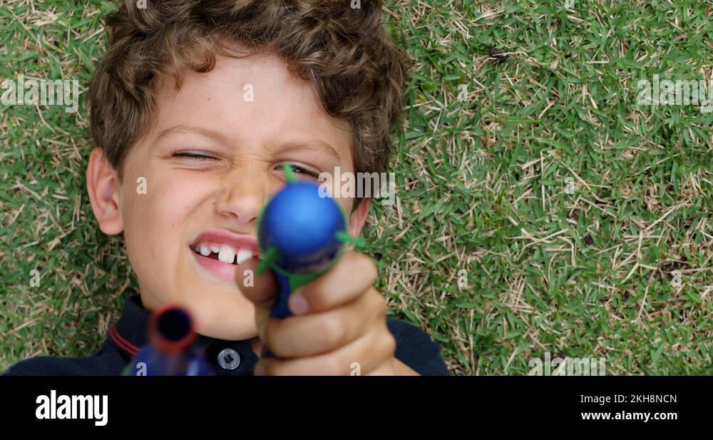 Kid with toy gun Stock Videos & Footage - HD and 4K Video Clips - Alamy