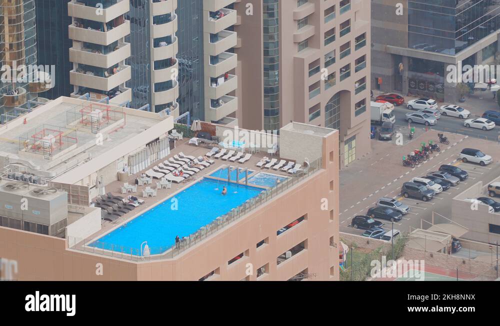 Car parking lot with rooftop swimming pool viewed from above, Aerial ...