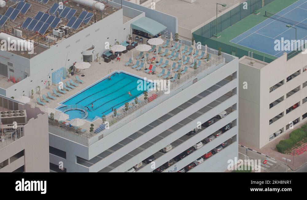 Car parking lot with rooftop swimming pool viewed from above, Aerial ...