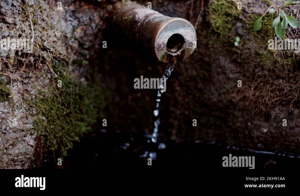 Clear potable raw water source. Spring water chute, pure mineral water ...