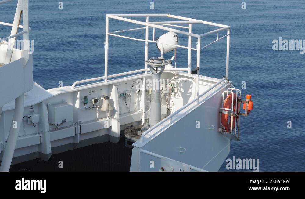 white bridge wing of a cargo ship with a orange lifebouy Stock Video ...