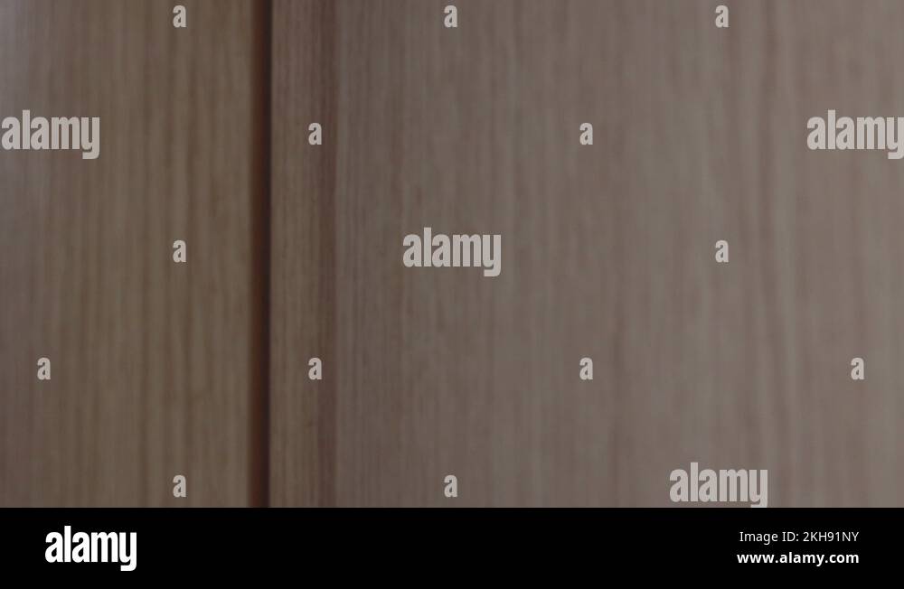 a man looks with a frightened eye at the door slit Stock Video Footage ...