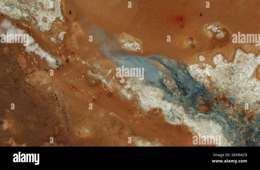 Aerial top down view of boiling mud pits and fumaroles in Hverir ...