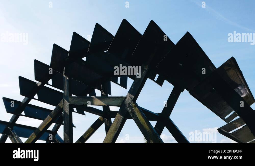 Water wheel of water mill. Drops of water run down the blades Stock ...