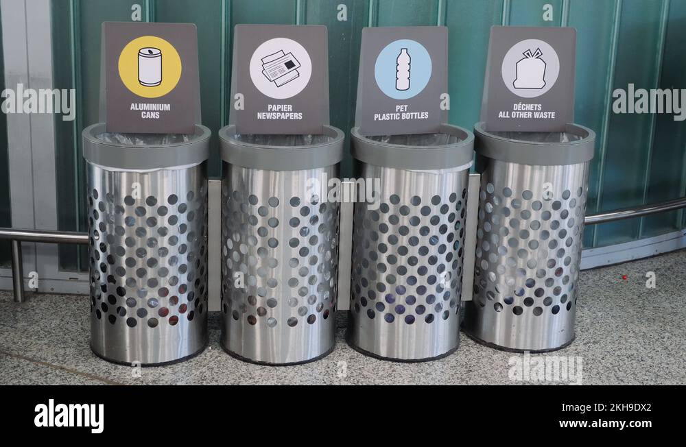 Litter bins with plastic, glass and paper sorting. Garbage distribution ...