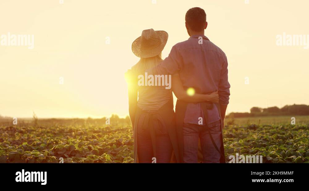 Back view on the Caucasian happy romantic couple in love standing ...