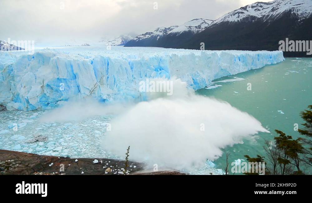the ice ruptures and huge chunks of ice fall into the lake Stock Video ...