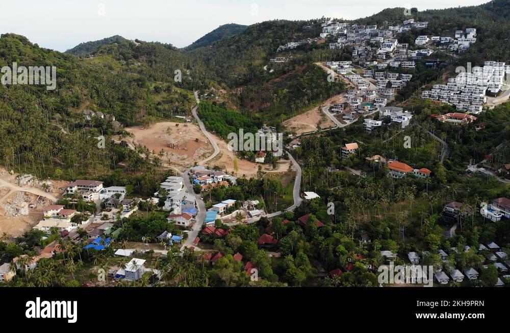 Tropical terrain covered with endangered forests and luxury villas ...