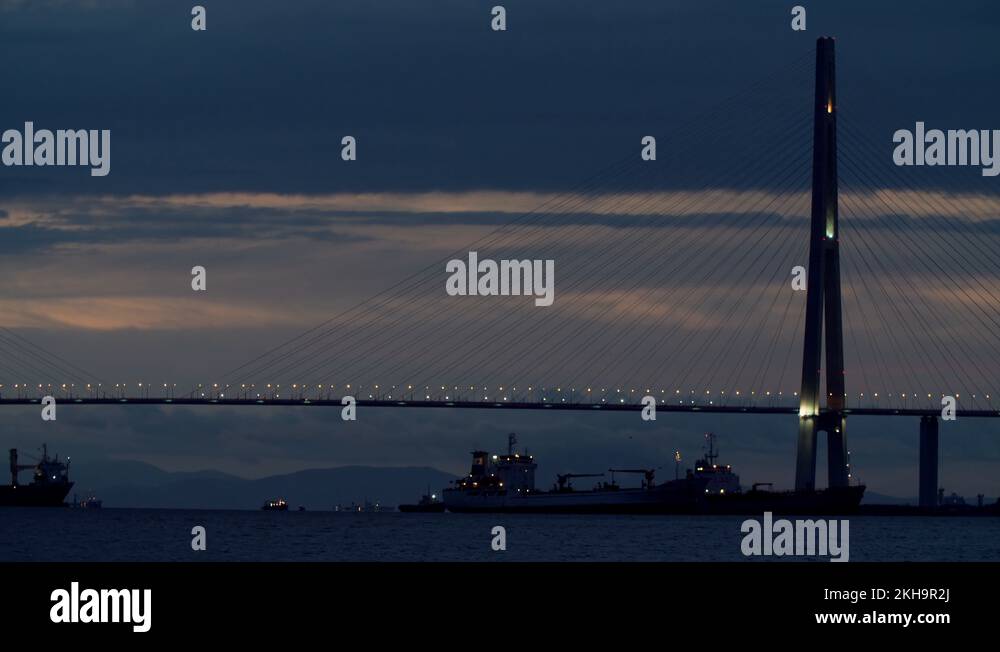 Russian bridge with warning lights and silhouette of military ship ...