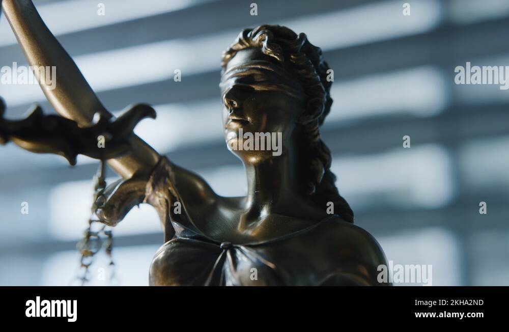 Close up and medium Lady Justice blindfolded and holding balance scales ...