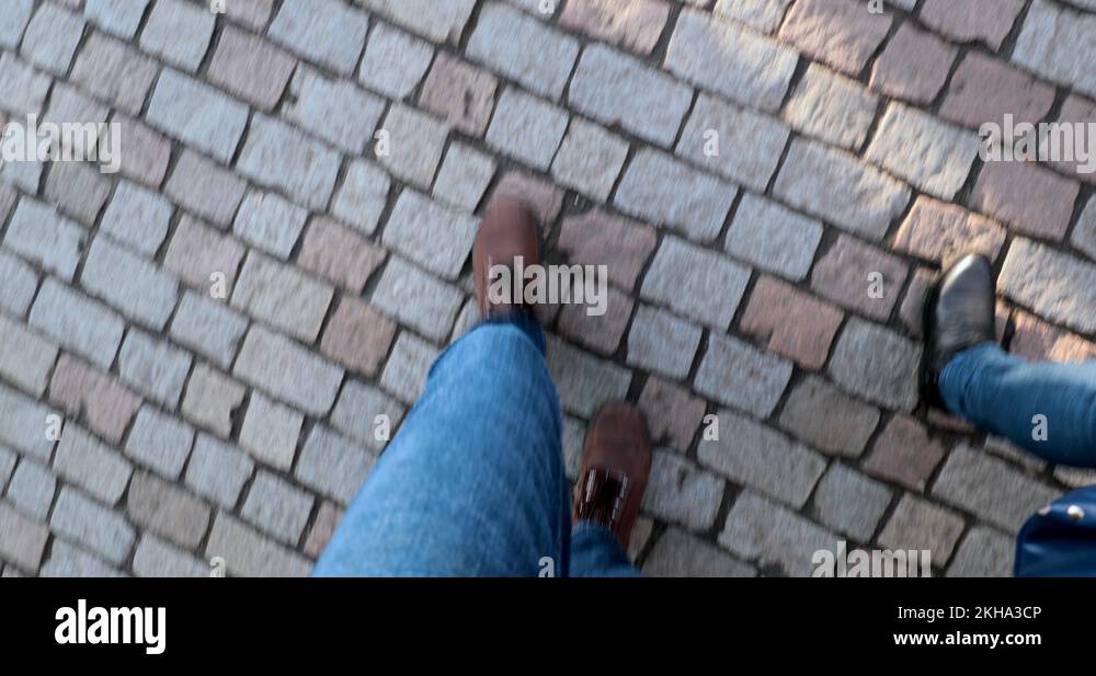 Point of view of man walking in cobblestone medieval town. POV of ...