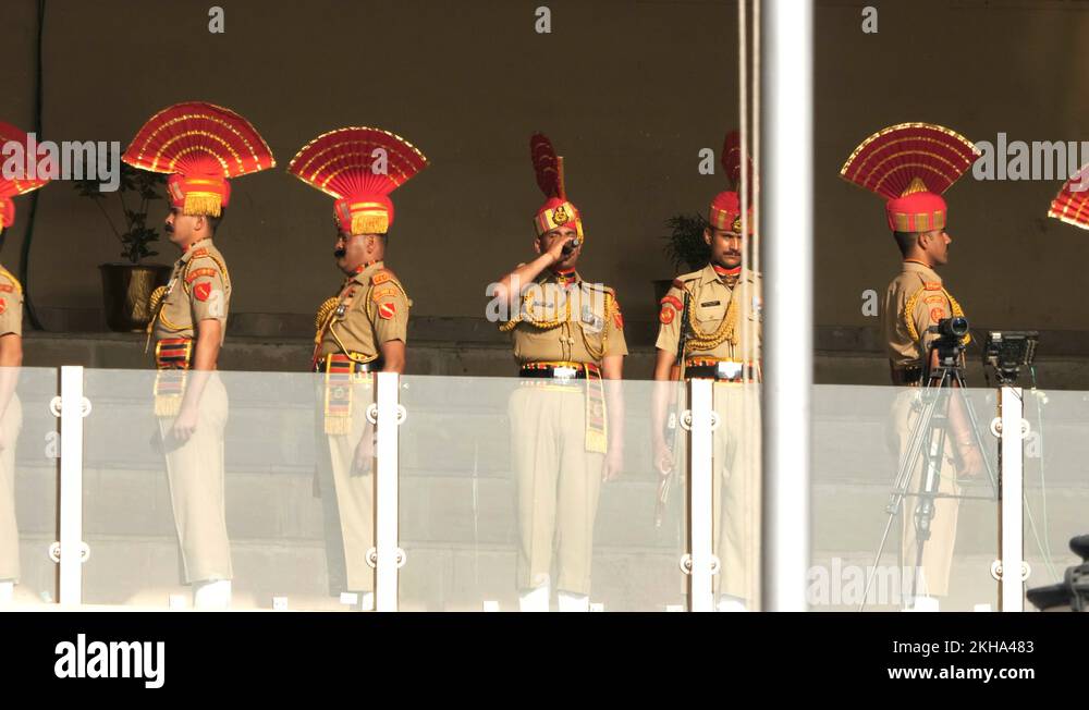 guards standing to attention on a balcony at wagah border in amritsar ...