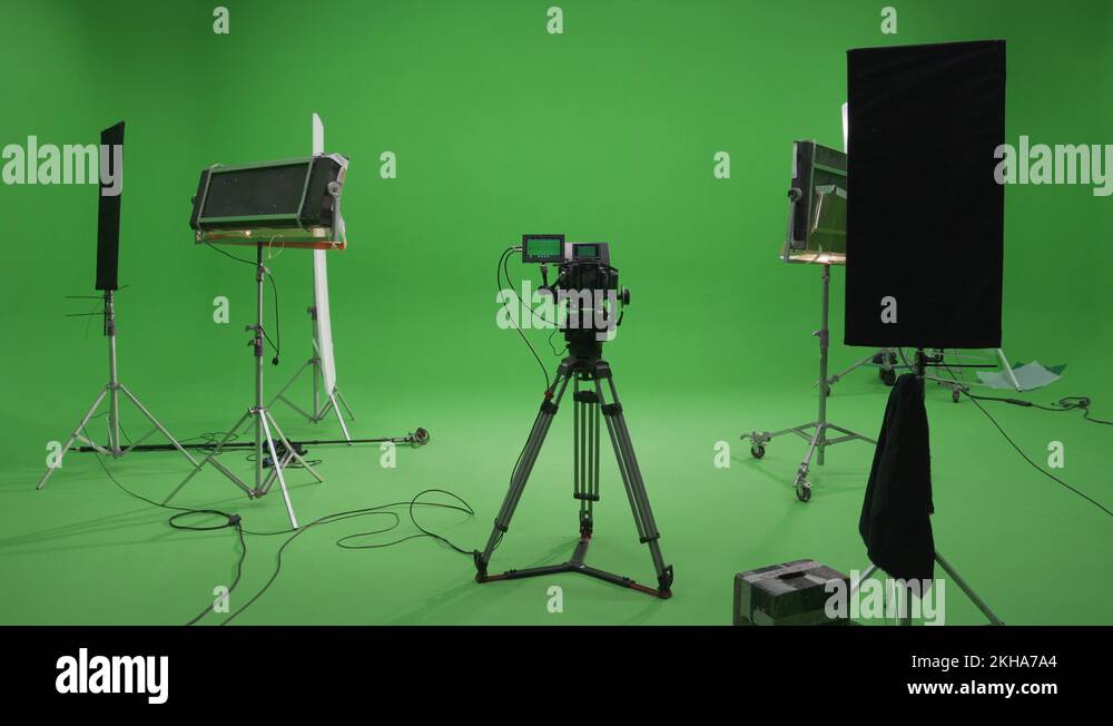 Behind The Scenes filming set red camera on tripod and green screen ...