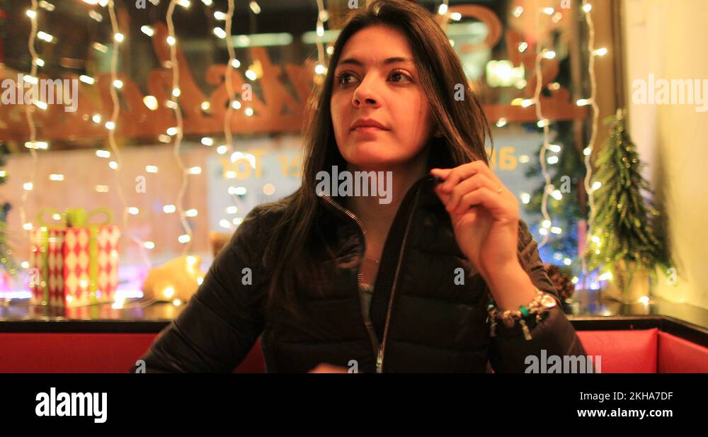 Woman taking her jacket off. Candid authentic real life girl removing ...