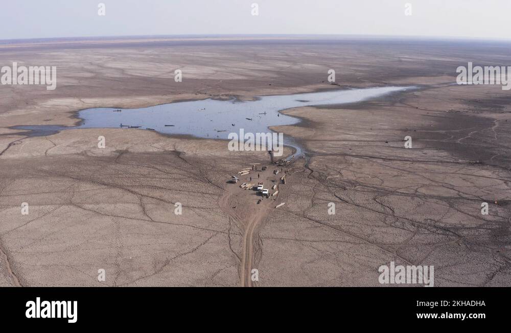 level of devastation of a drying up lake due to drought and climate ...