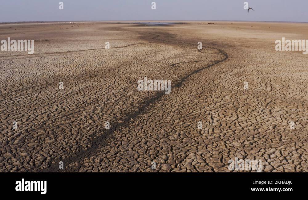 level of devastation of a drying up lake due to drought and climate ...