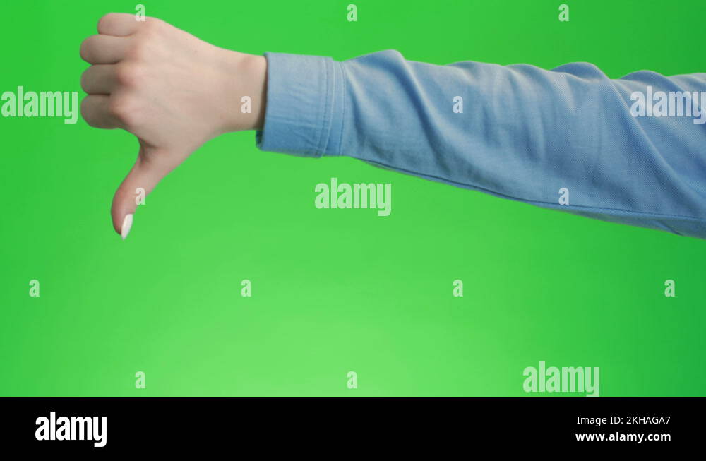 Thumbs down sign hand gesture on green screen. Simbol of disapproval ...