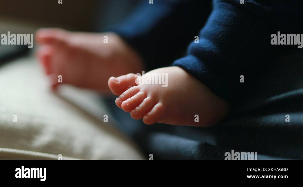Newborn baby feet closeup chubby foot Stock Video Footage - Alamy