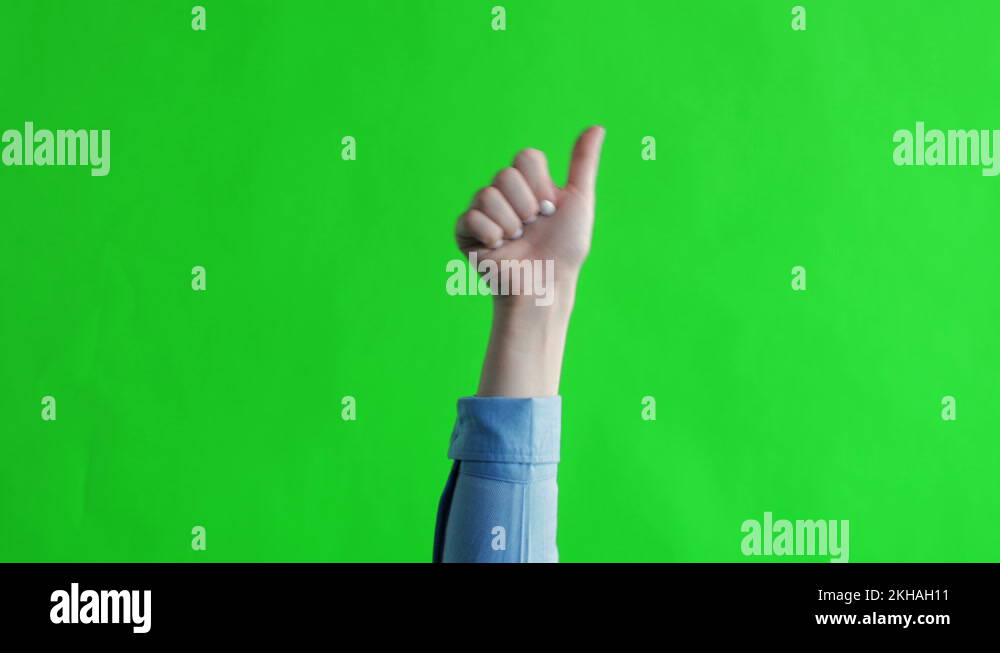 Thumbs up sign hand gesture on green screen. Simbol of approval like ...