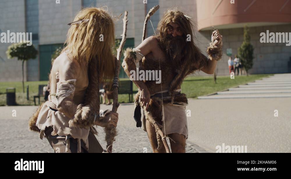 Caveman man of hunter-gatherers in animal fur holding prehistoric ...