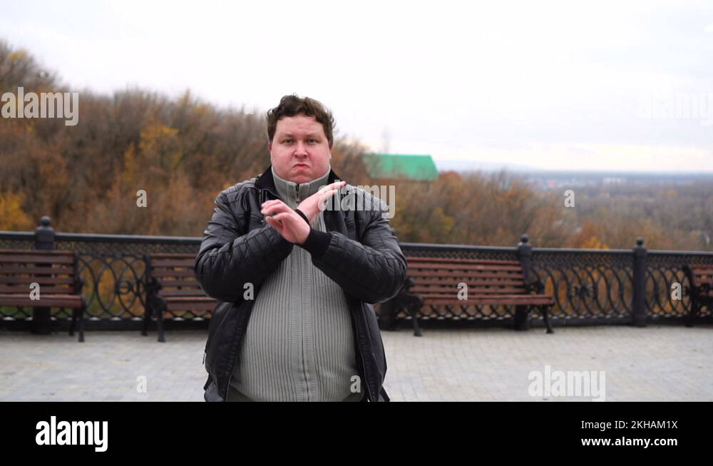 Zoom in portrait of fat man showing stop sign, rejecting gesture ...