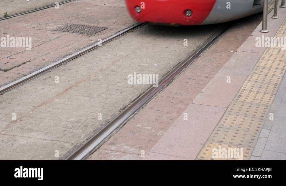 tram arrives at stop platform and passengers approach door Stock Video ...
