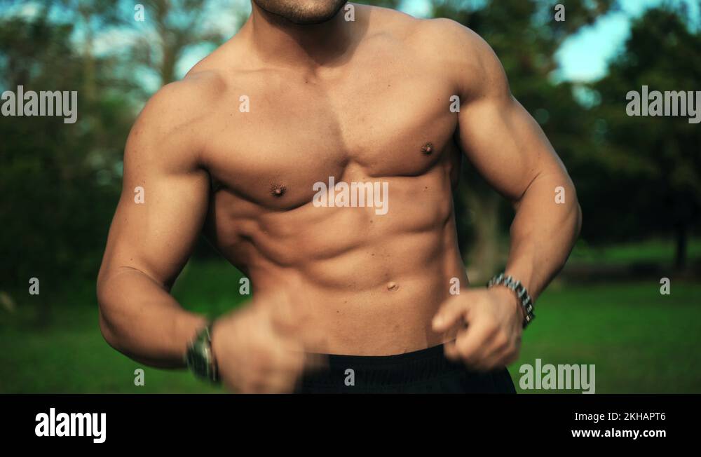 Handsome strong shirtless sportsman with perfect six pack torso posing ...