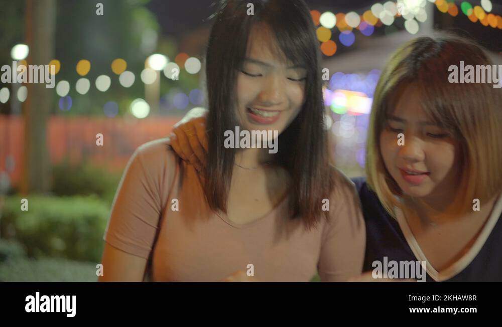 Tourist Asian sister girls direction on location in Bangkok, Thailand ...