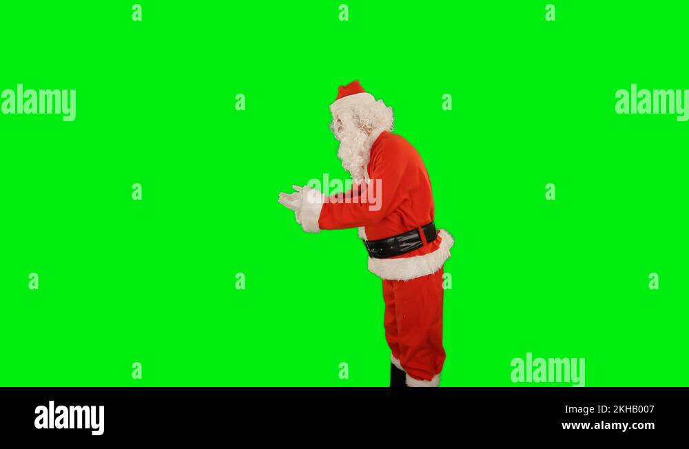 Santa Claus blowing magic powder from his hands side view Green Screen ...