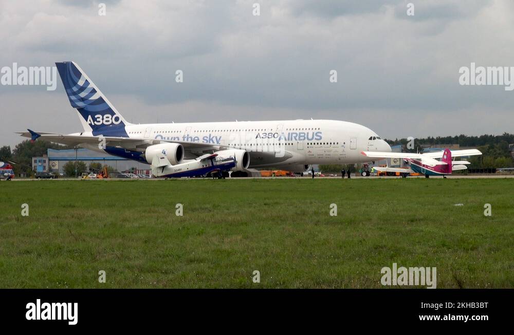 Towing four-engine wide-body two-story passenger aircraft Airbus A-380 ...