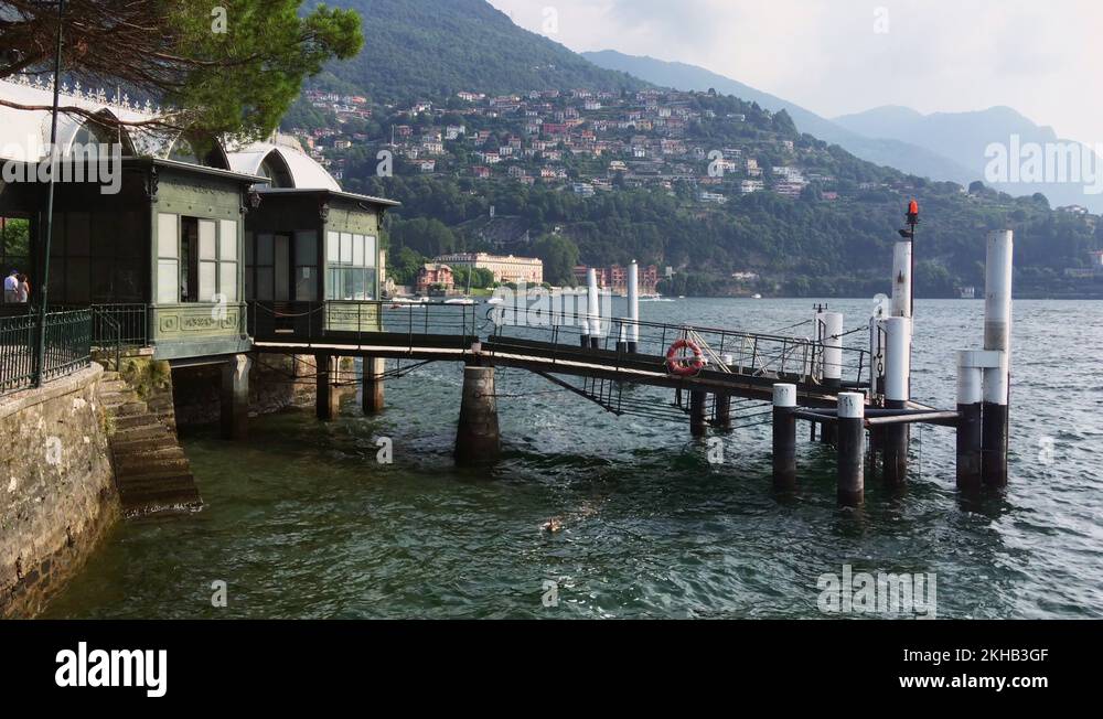 como lake pier boat station and view of mountain town Stock Video ...