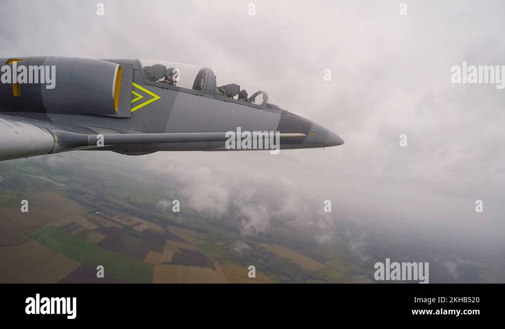 Gray combat jet plane make Split S maneuver. Dangerous trick. View from ...