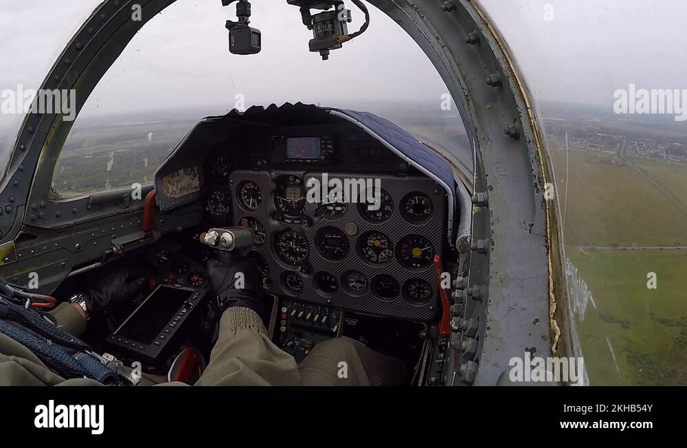 Jet is tilted to the left and flies. View of cockpit and dashboard ...