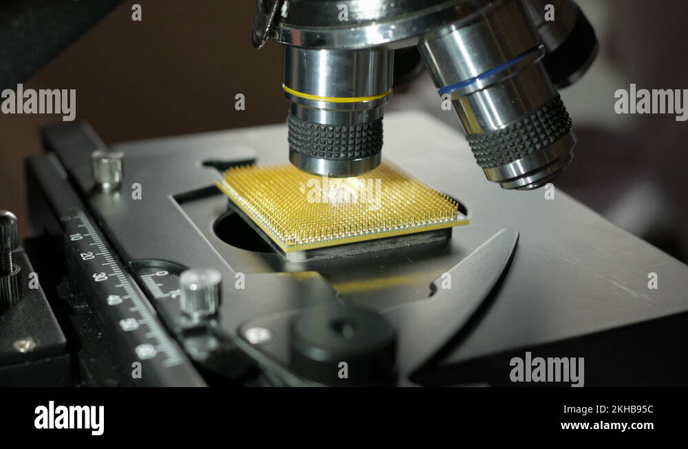 Processor is being examined for apparent defects under microscope. In ...