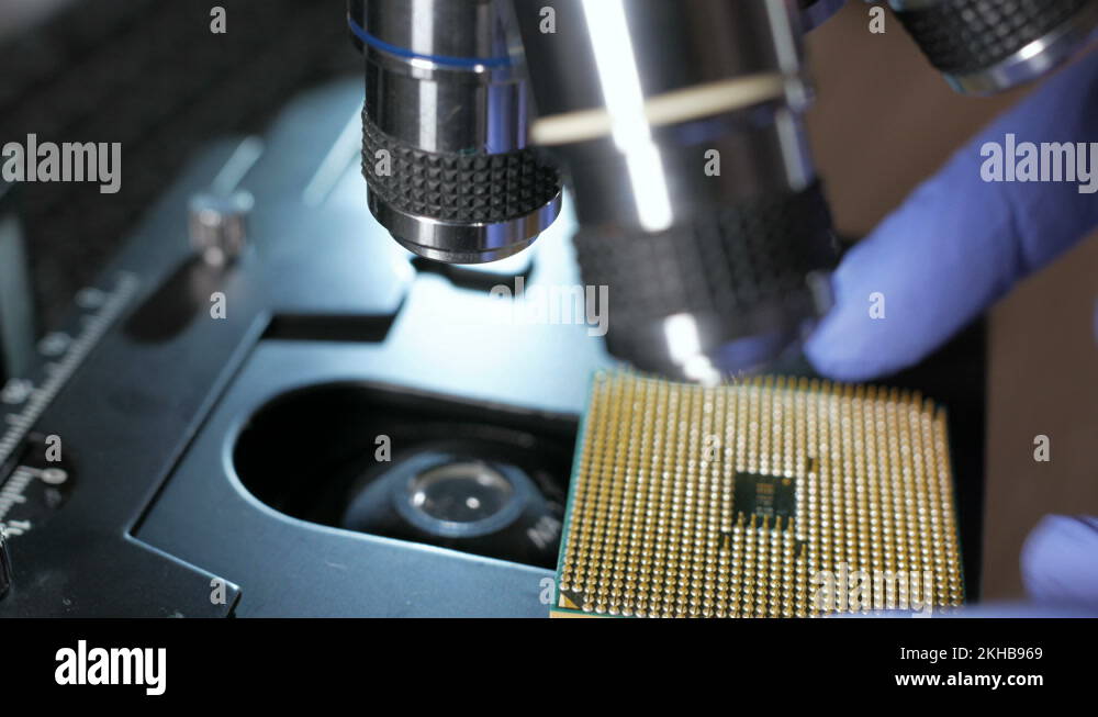 Processor is being examined for apparent defects under microscope. In ...