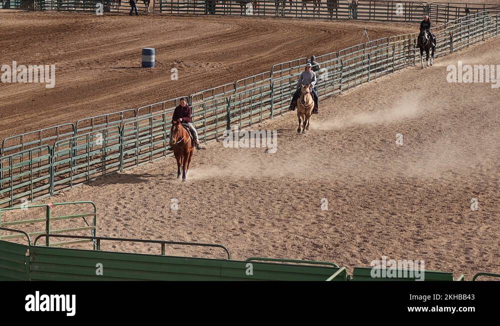 Women Riding Horses in Practice Arena in Slow Motion - Shallow Depth of ...