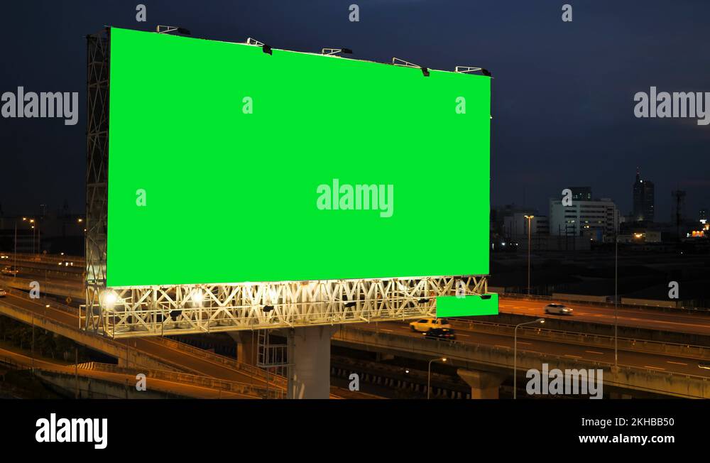 Green screen of advertising billboard on expressway during the twilight ...