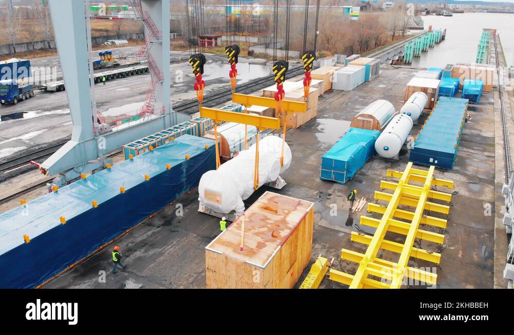 Cargo port - A big industrial crane moving the cargo from the freight ...