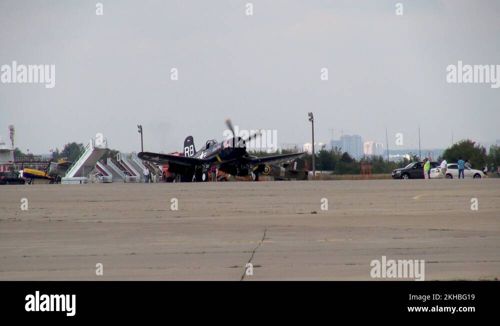 Chance Vought F4U Corsair fighter turns toward parking lot after ...