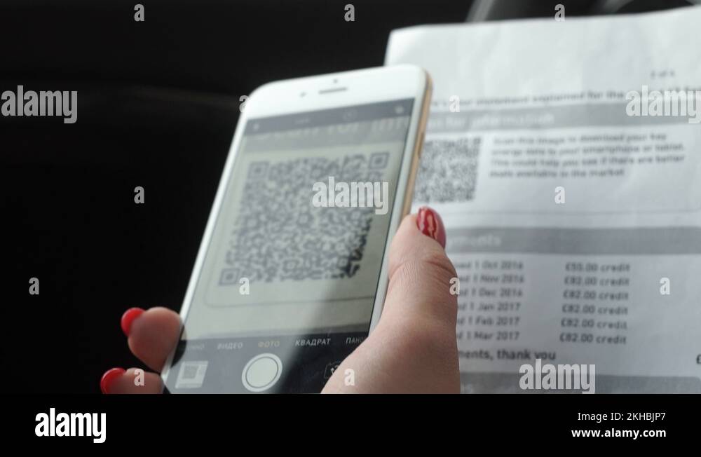 Woman scans QR Code. Payment of utility using QR code and mobile device ...