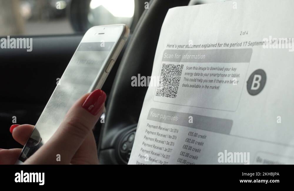 Woman scans QR Code. Payment of utility using QR code and mobile device ...