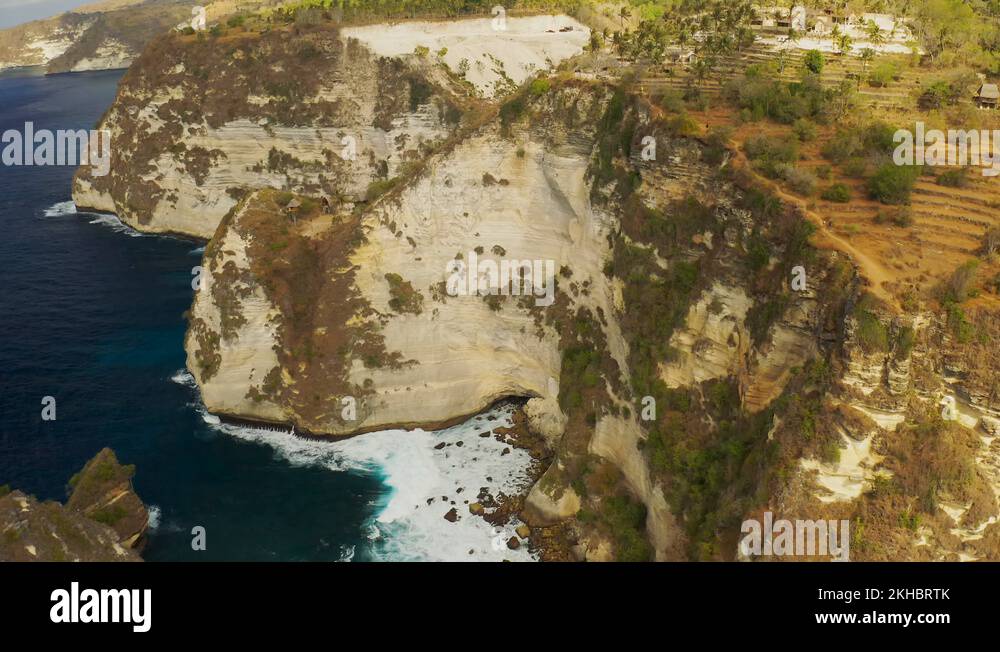 Diamond Beach on Nusa Penida island with a lone cliff top the wooden ...
