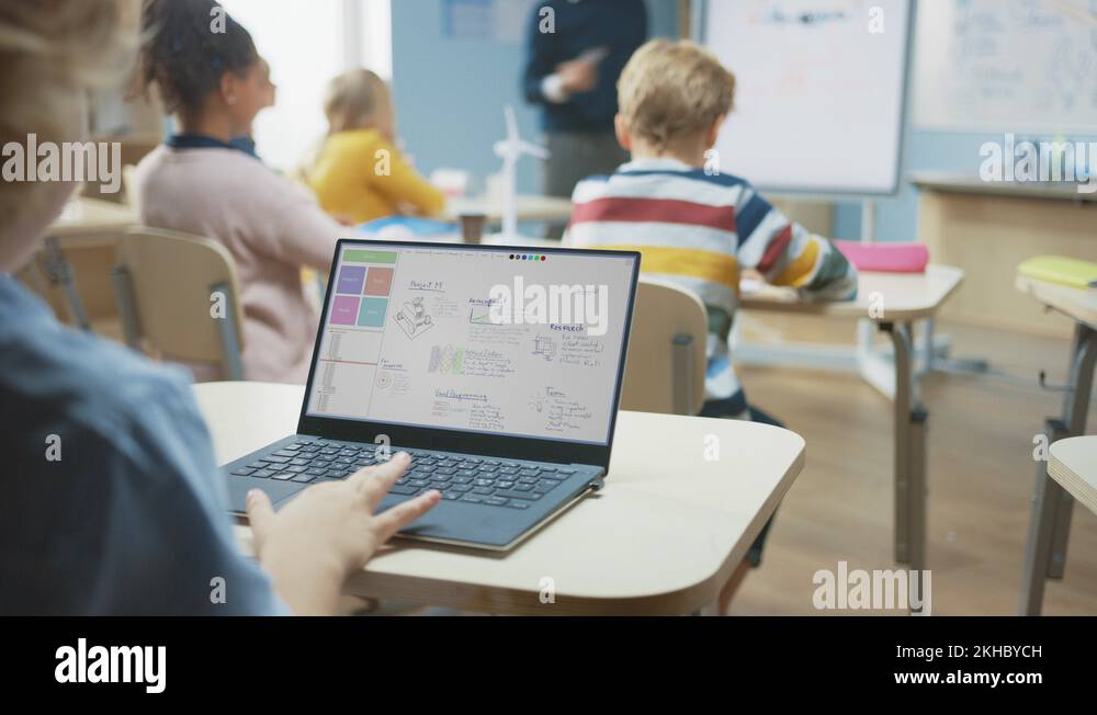 Elementary School Science Class: Little Boy Uses Laptop Robotics ...