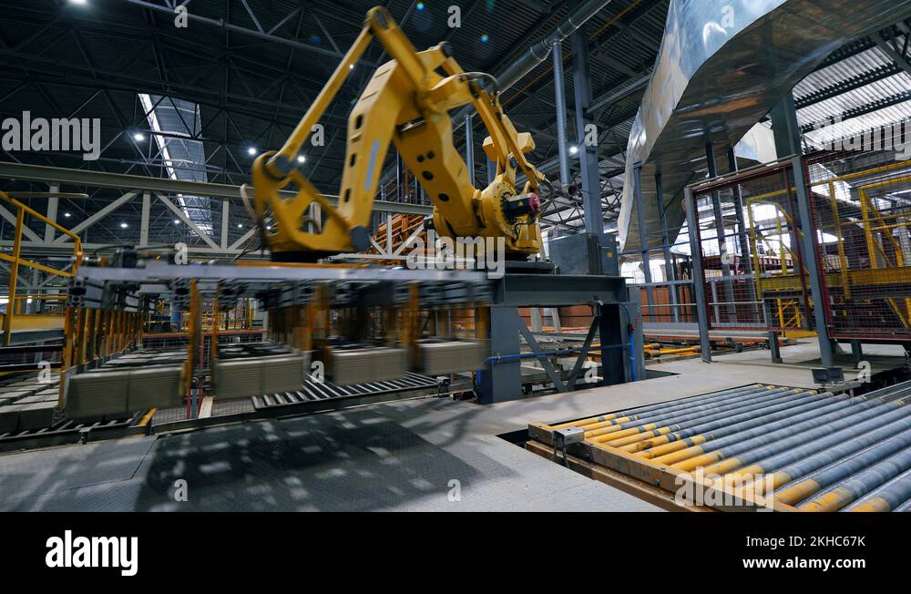 Working arm moves bricks on a line at a modern factory Stock Video ...