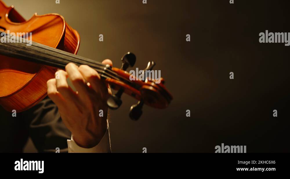 Experienced Violinist performing amazing solo on stage, spotted by ...