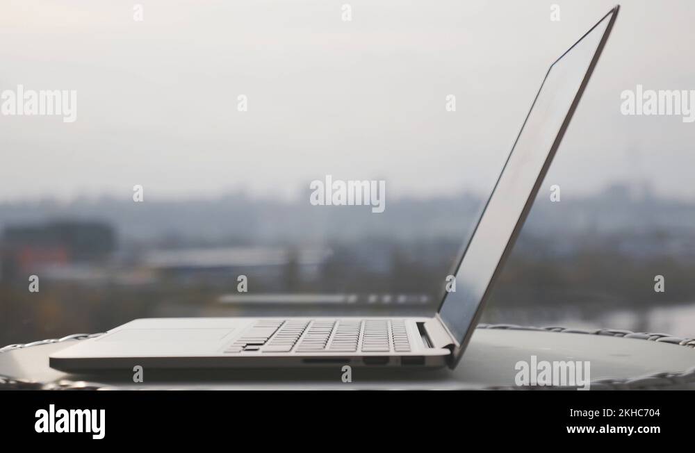 Hands using laptop typing and scrolling on computer touch pad. Business ...