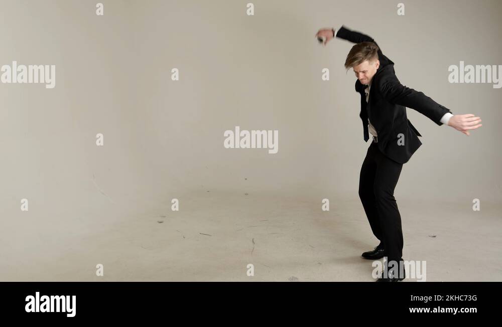 Guy In An Empty Room With White Walls Stock Video Footage - Alamy