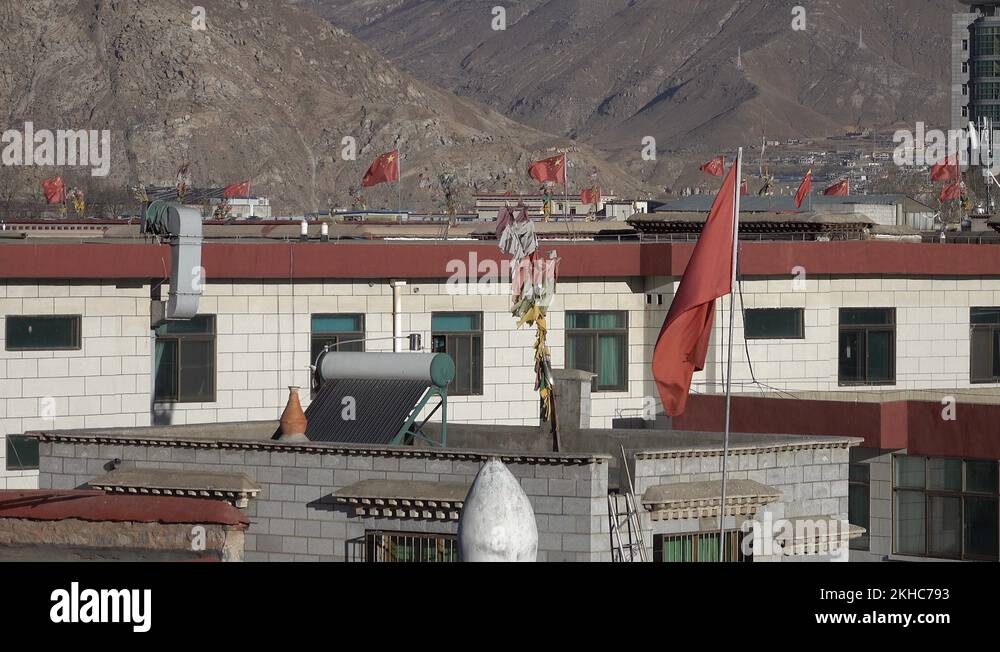 China Tibet politics - Chinese national flags wave on roofs traditional ...